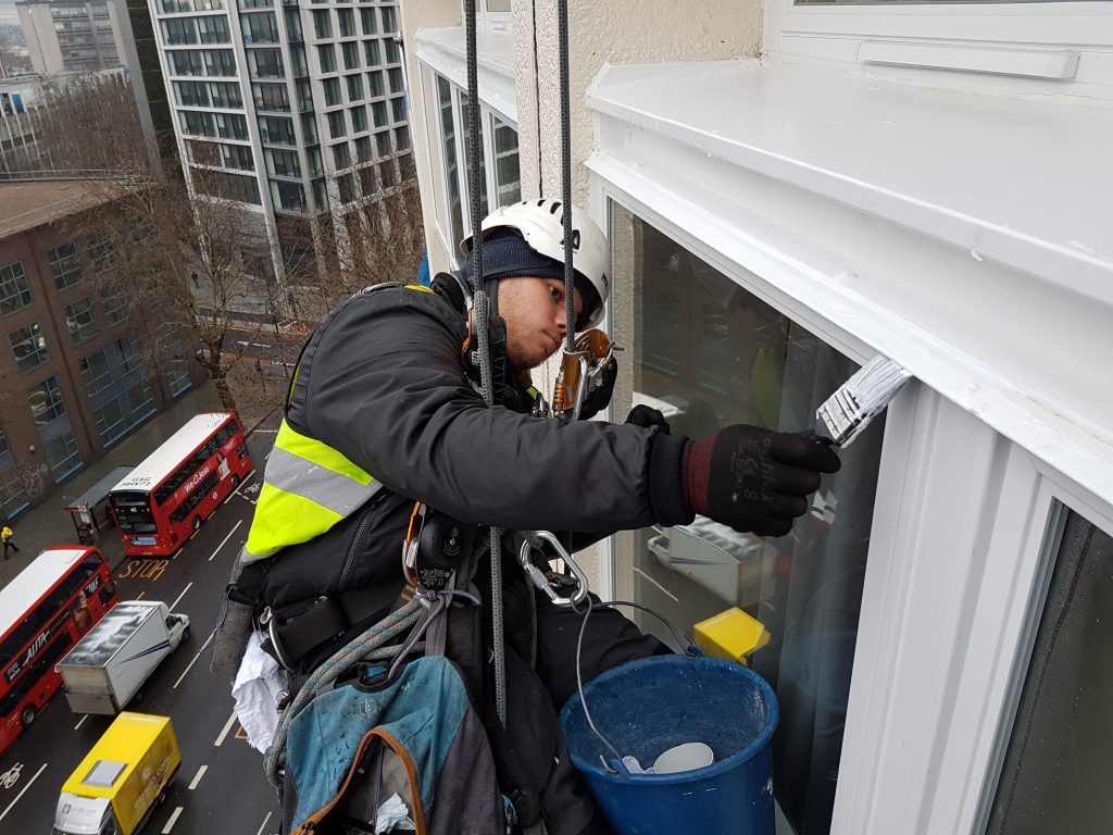 Rope access window painting - Repair Abseiling Ltd.