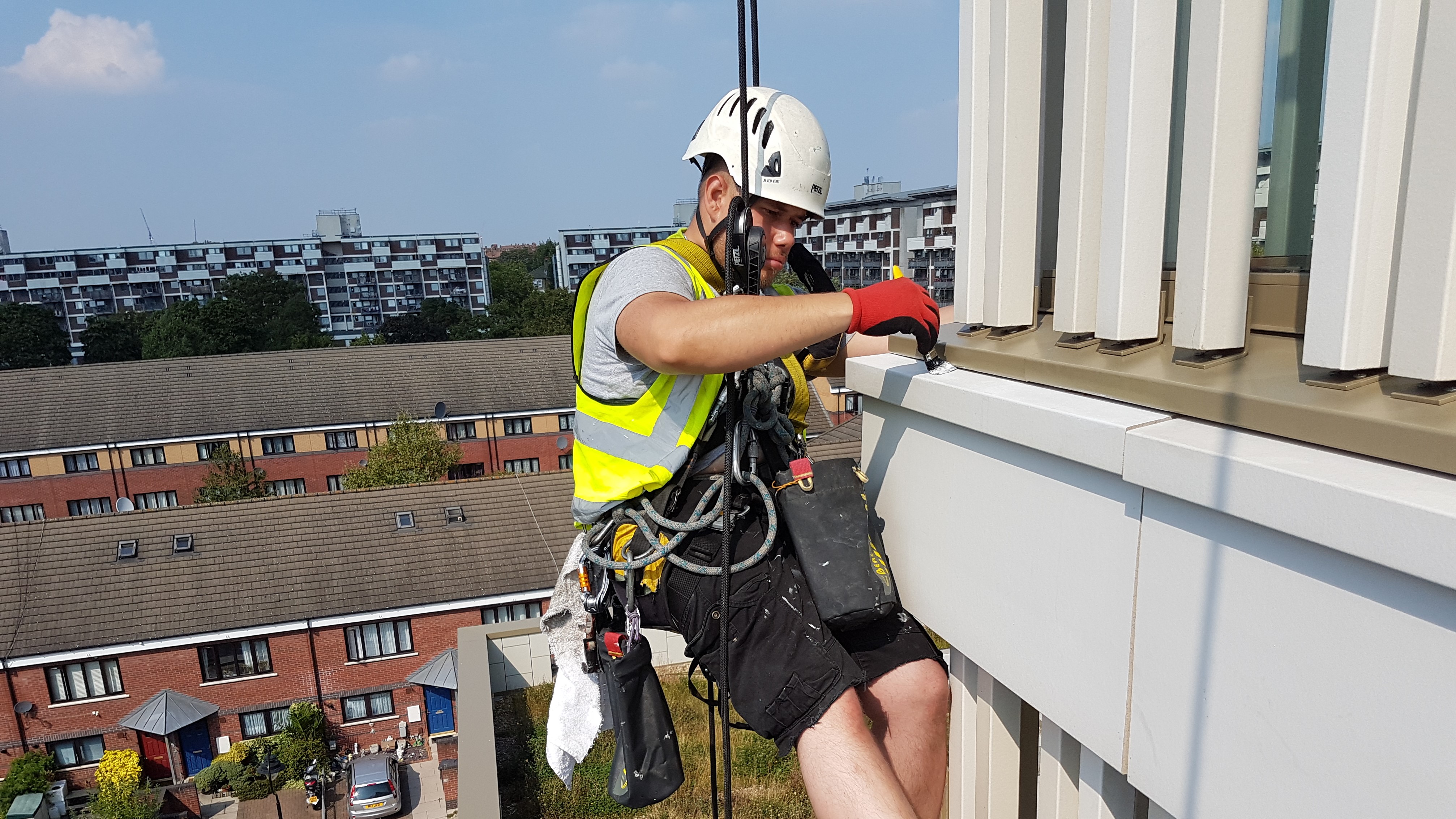 High rise building painting abseiling - Repair Abseiling Ltd.