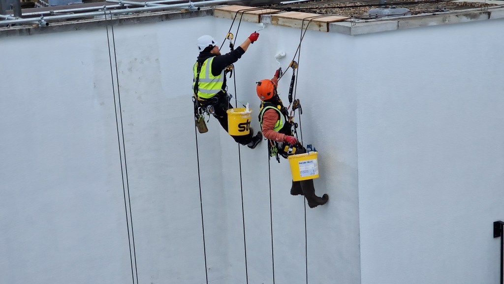 Exterior building painting using abseiling - Repair Abseiling Ltd.